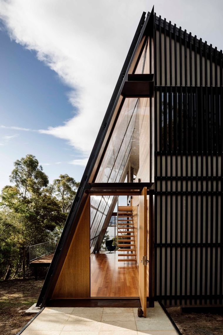 New Spaces Draped Around an Original Cedar-lined Shack Like a Tent