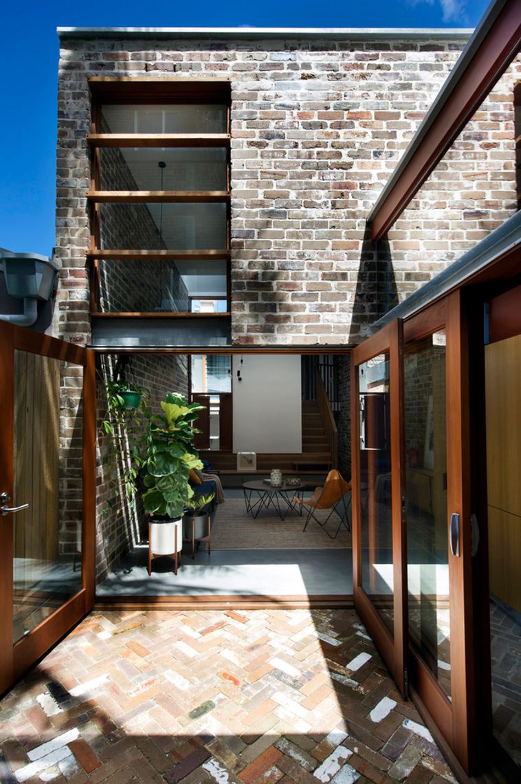 A Beautiful Warm Home is Carved Out of a Tight Block with No Views