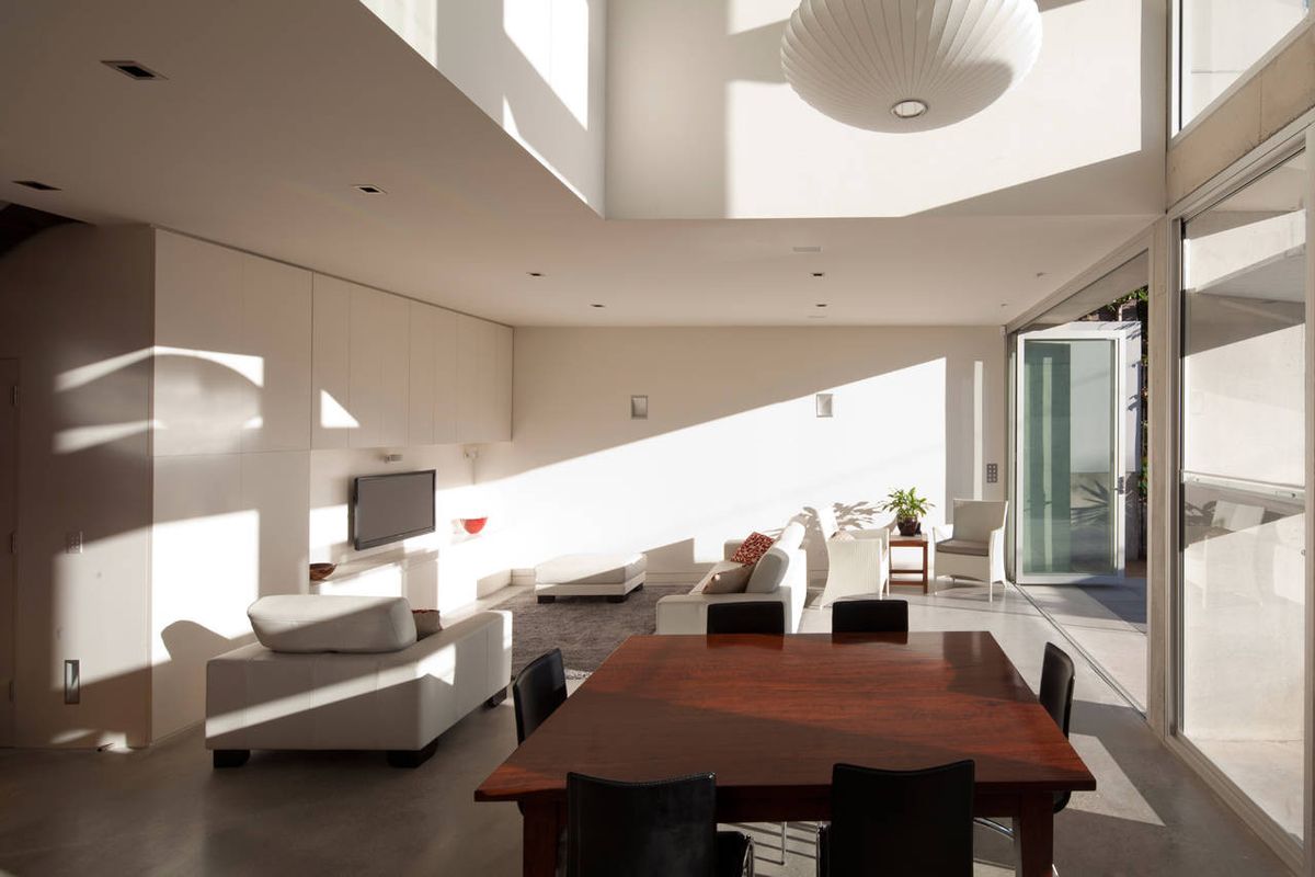 A Rear Facade Playfully Filters and Disperses Light at Balmain House