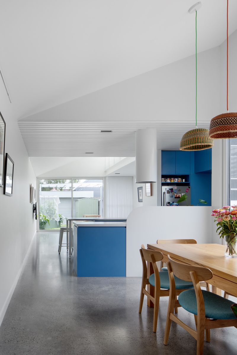 This addition feels spacious in spite of a long, narrow block...