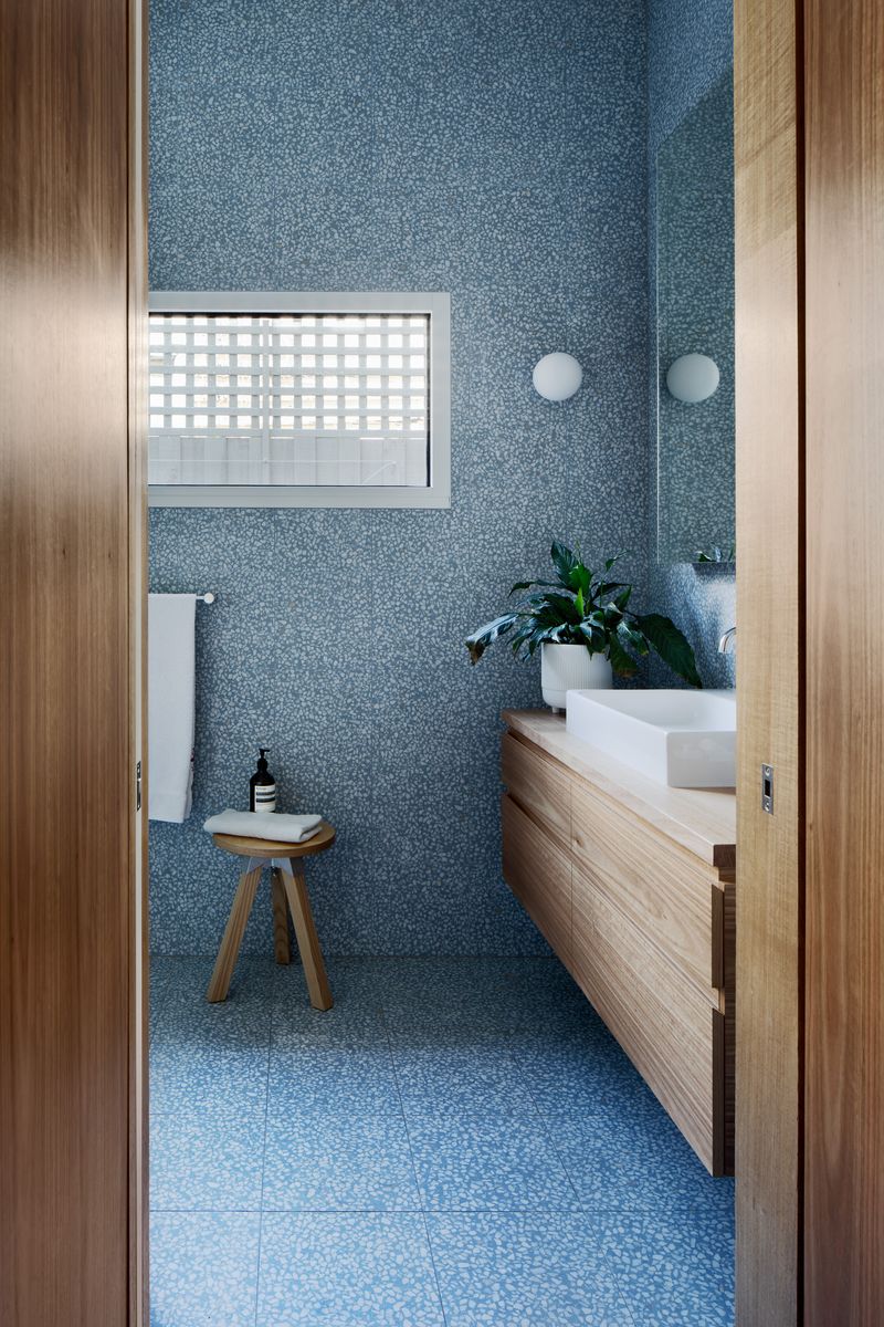 This addition feels spacious in spite of a long, narrow block...