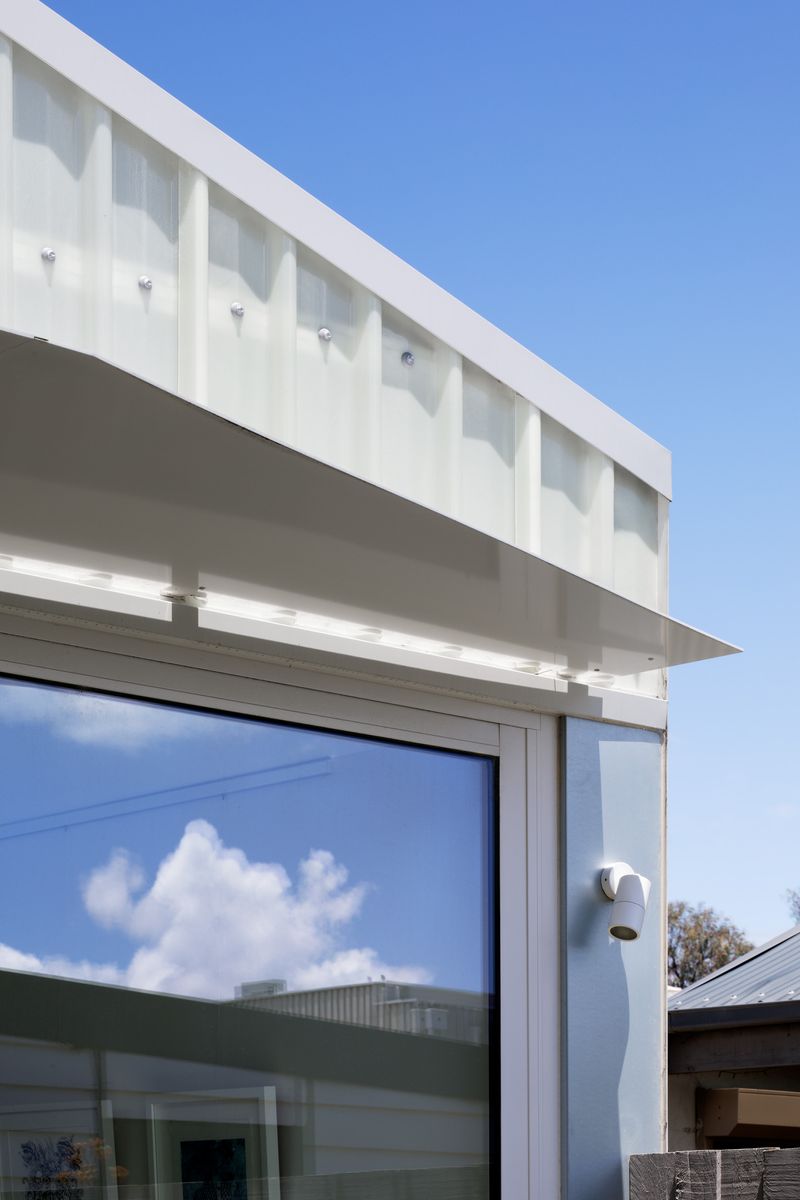 This addition feels spacious in spite of a long, narrow block...
