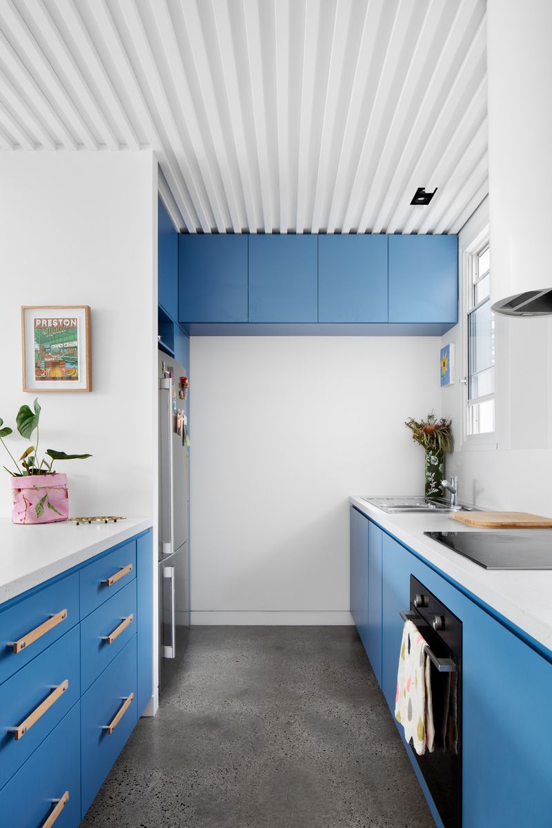 This addition feels spacious in spite of a long, narrow block...