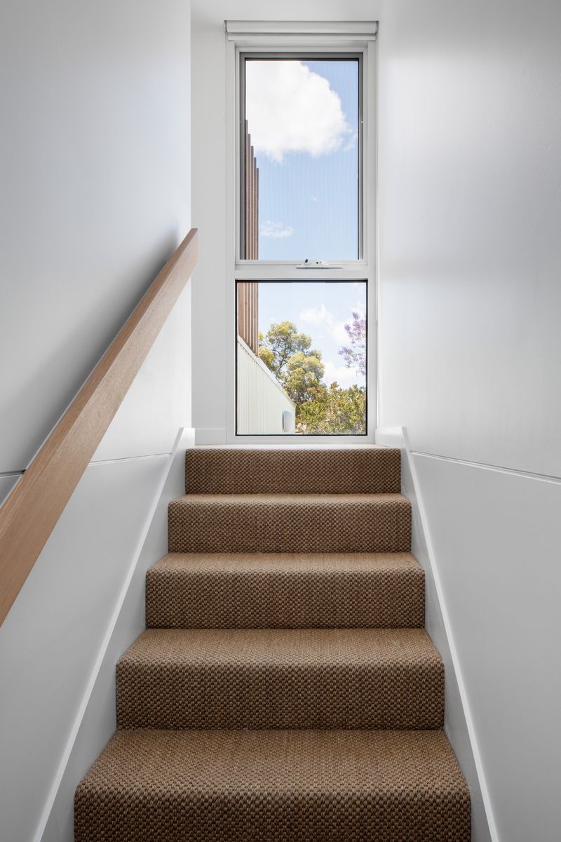 This addition feels spacious in spite of a long, narrow block...