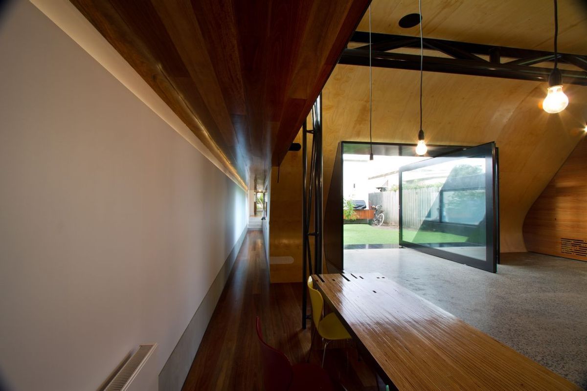 Hill House: They Built a Sunny Living Area Under a Grassy Knoll