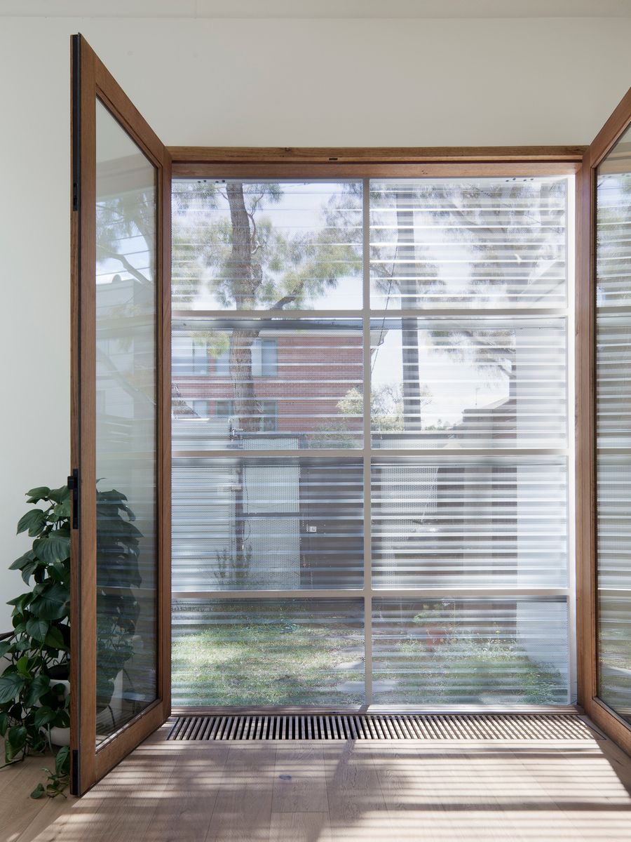 Perforated Sliding Door Provides Privacy Without Blocking Views or Light