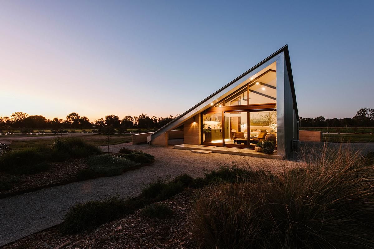 Sculptural Roofs and Rammed Earth Walls Define this Bold Design