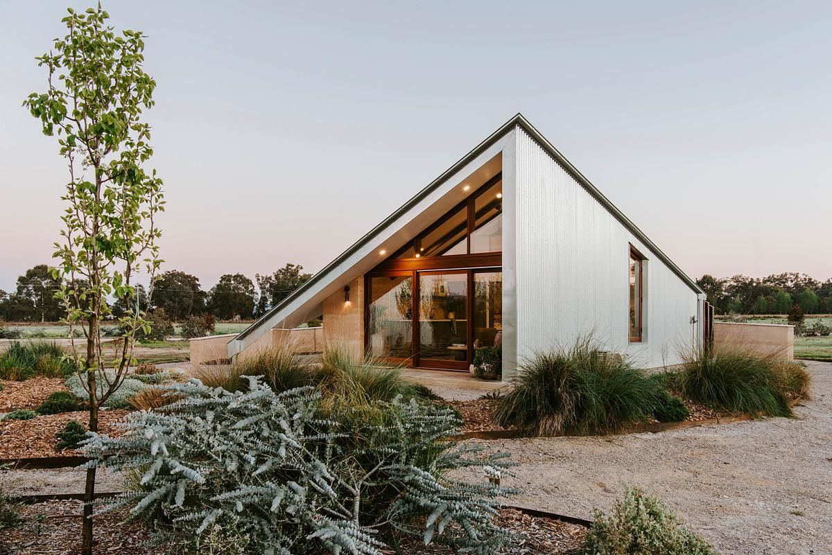 Sculptural Roofs and Rammed Earth Walls Define this Bold Design