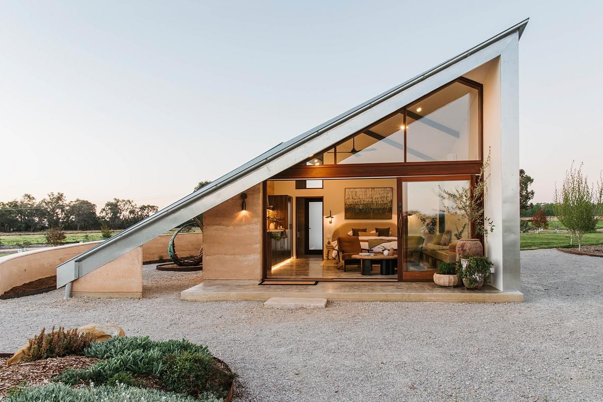 Sculptural Roofs and Rammed Earth Walls Define this Bold Design