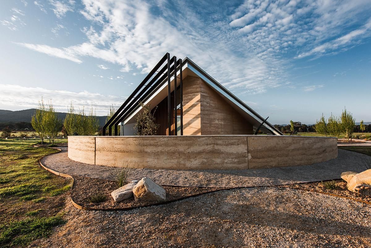Sculptural Roofs and Rammed Earth Walls Define this Bold Design
