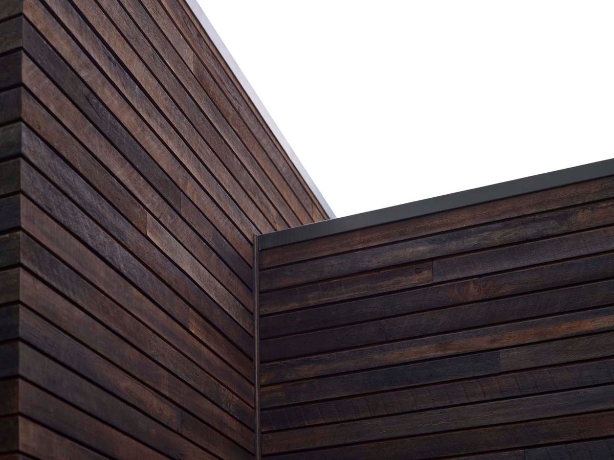 1970s Home Transformed by a Charred Timber Addition