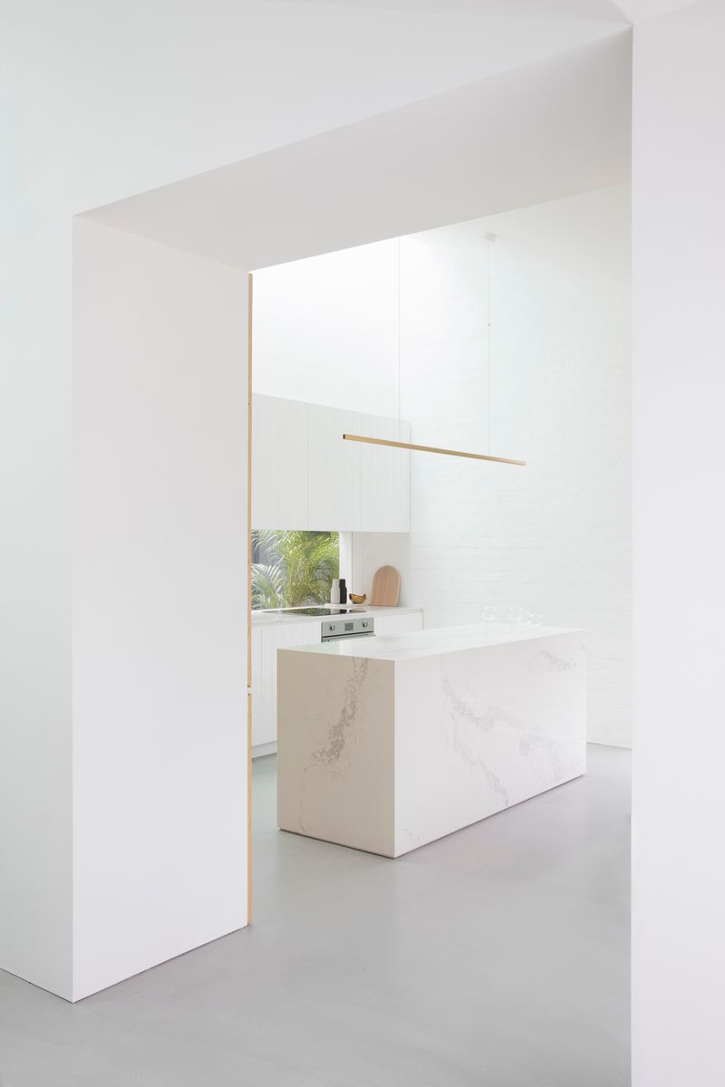 New Addition Steps Down Half a Level to Reunite House and Garden