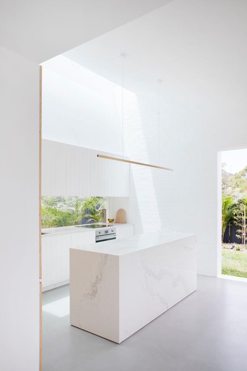 New Addition Steps Down Half a Level to Reunite House and Garden