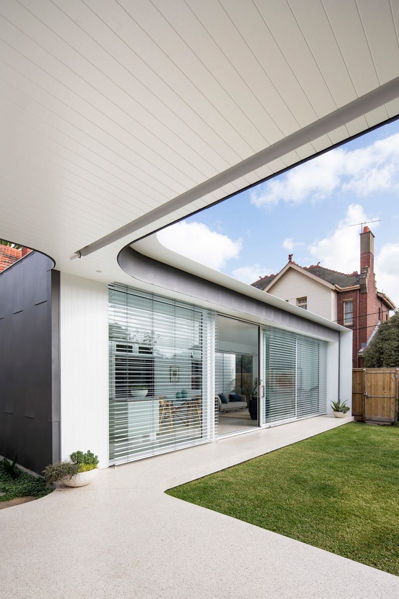 Outside In House: This Modern Extension Doesn't Steal the Limelight