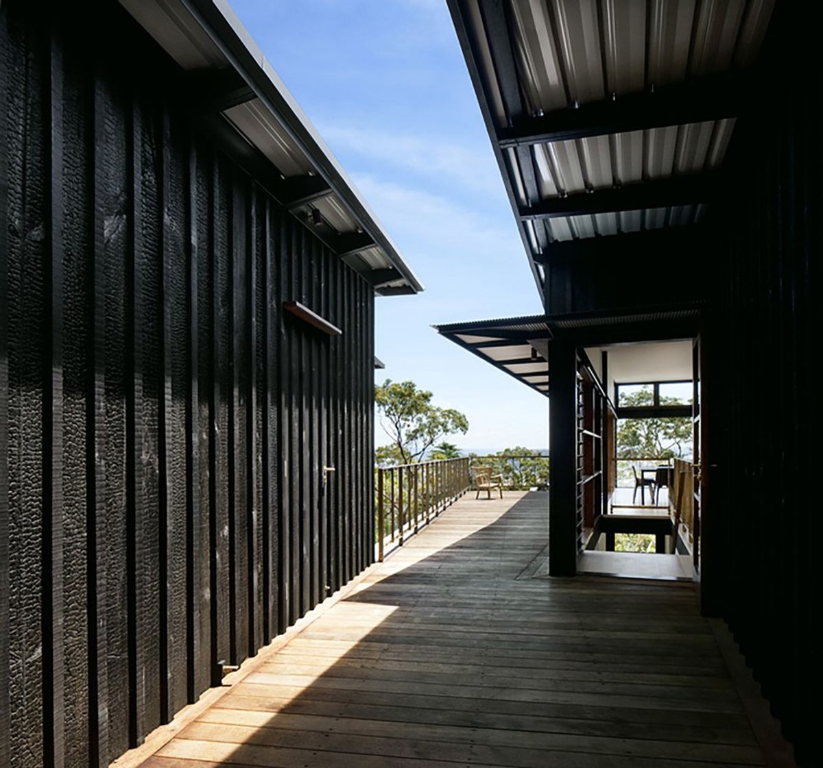 Pacific House Uses Burnt Timber and Rusting Steel to Dramatic Effect