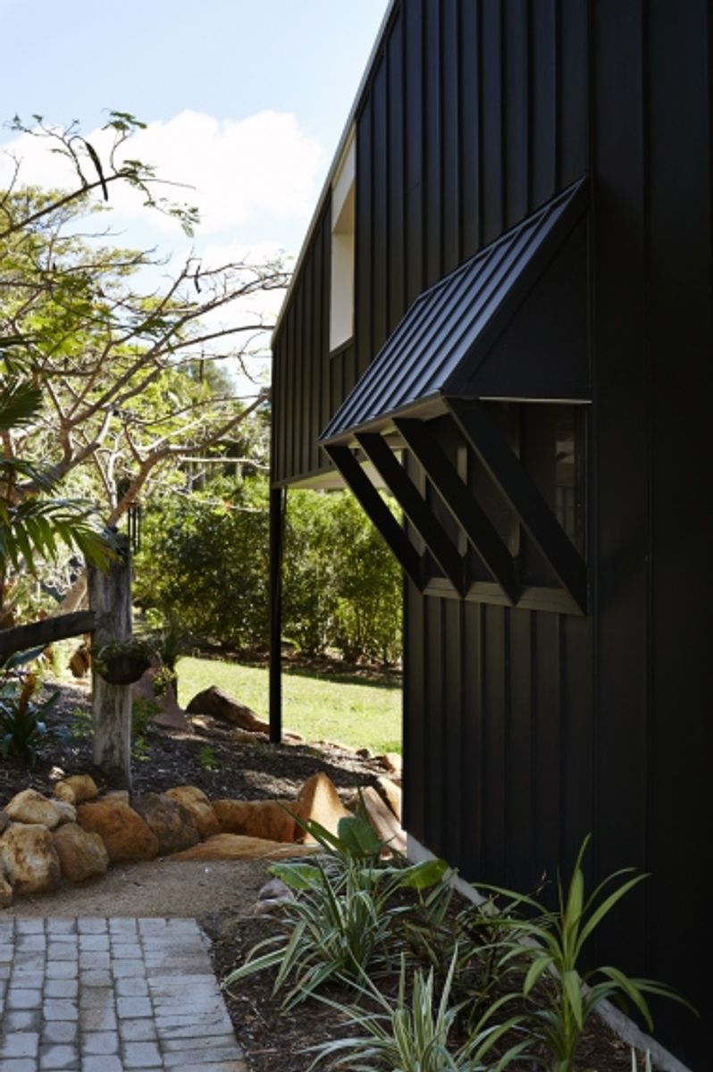 A New Triangular Kitchen Extension Creates New Informal Living Area