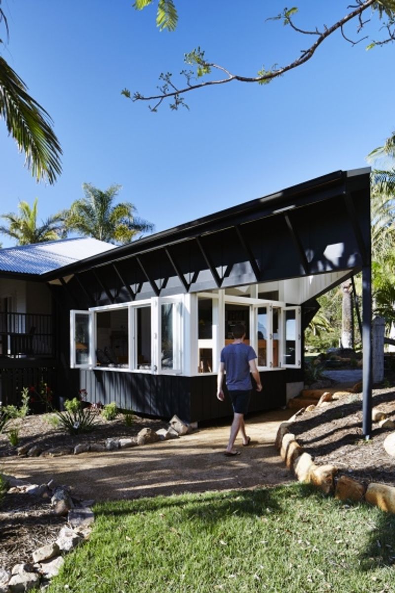 A New Triangular Kitchen Extension Creates New Informal Living Area