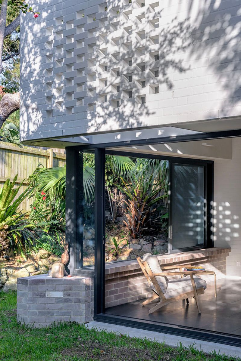 A Lounge Pavilion Set in a Sunken Garden Feels Both Indoors and Out
