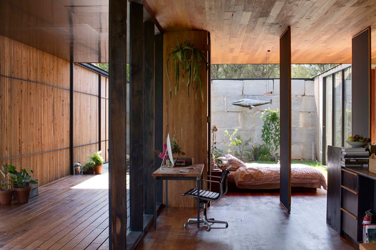 Sawmill House Rethinks Waste Materials to Create Raw, Rustic Beauty