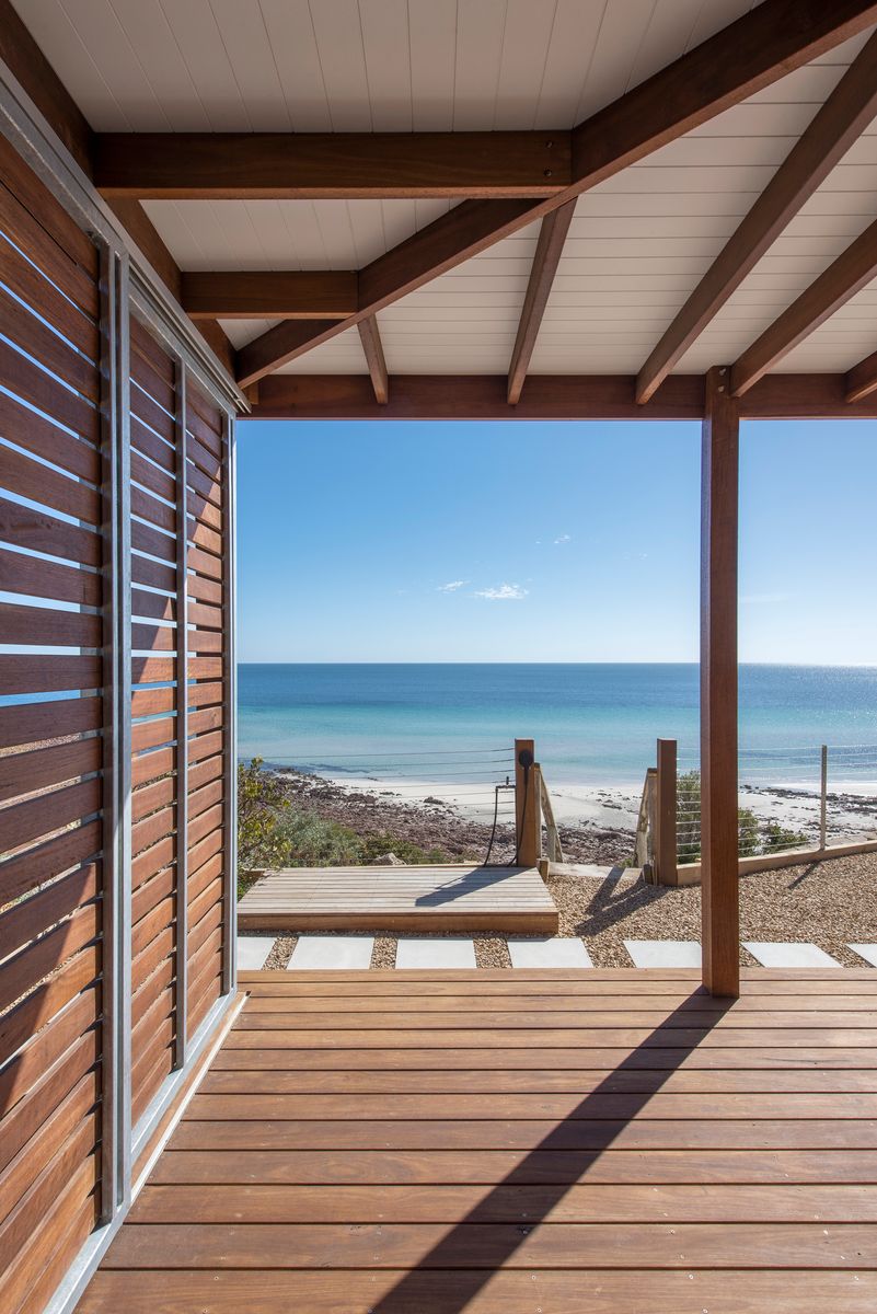 Beach House Nestles Into Its Spectacular Limestone Cliff Setting