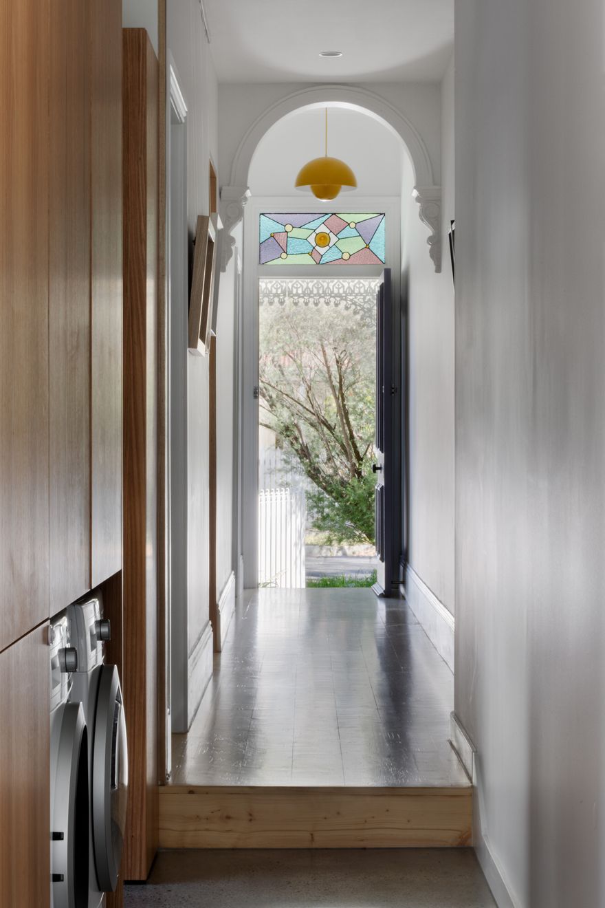 This addition feels spacious in spite of a long, narrow block...