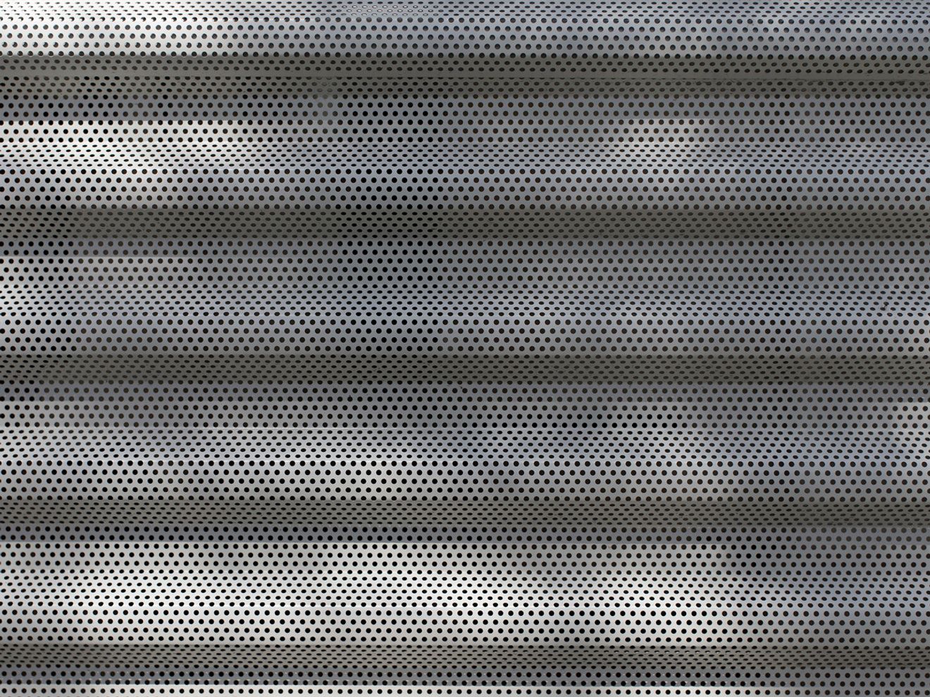 Perforated Sliding Door Provides Privacy Without Blocking Views or Light