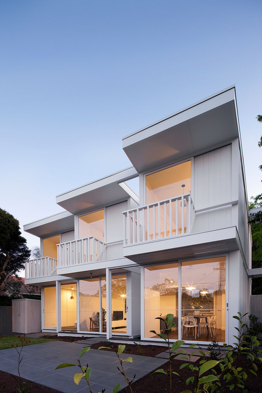 Folded Facades Give Two Identical Homes Their Own Identity