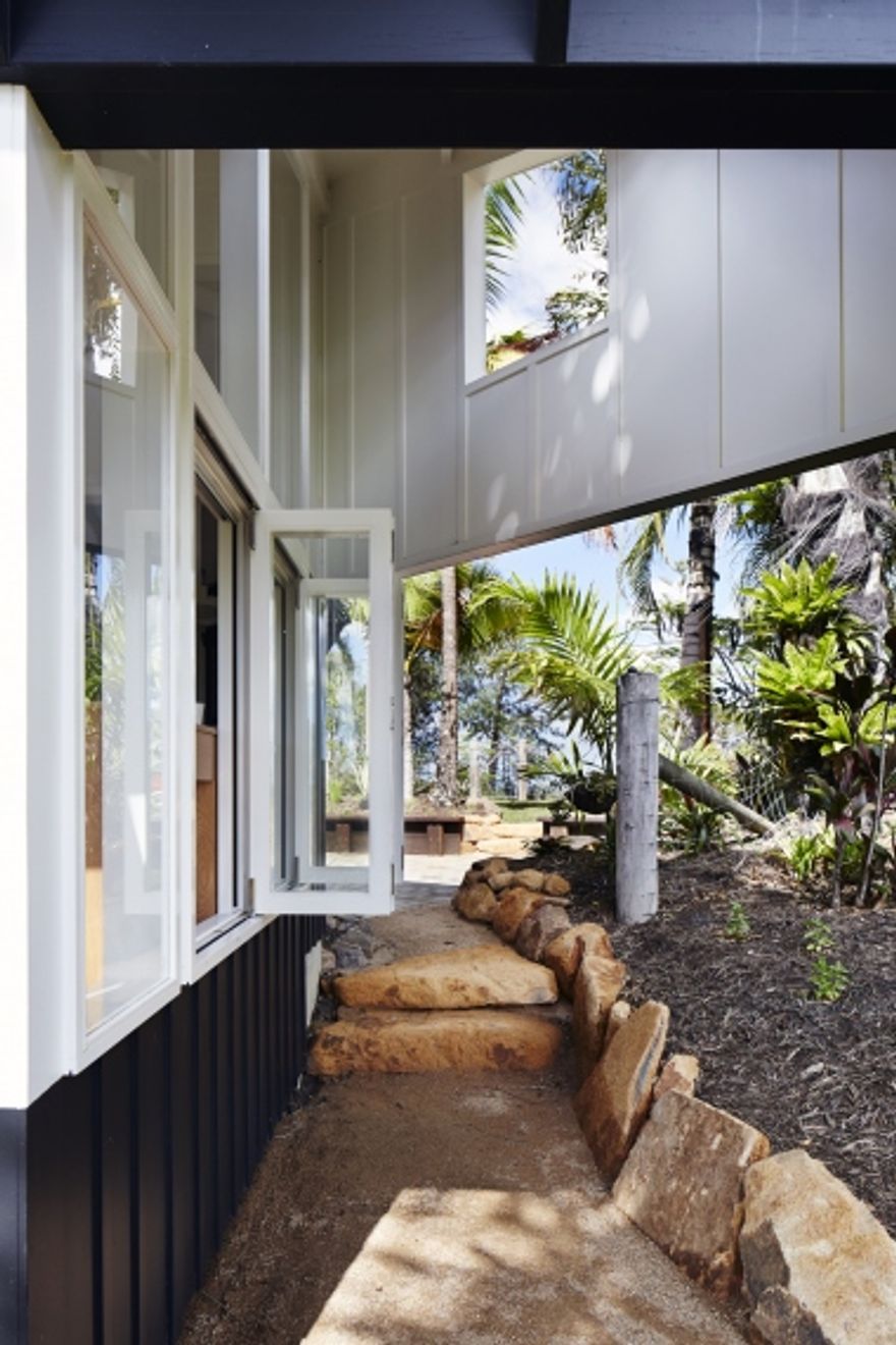 A New Triangular Kitchen Extension Creates New Informal Living Area