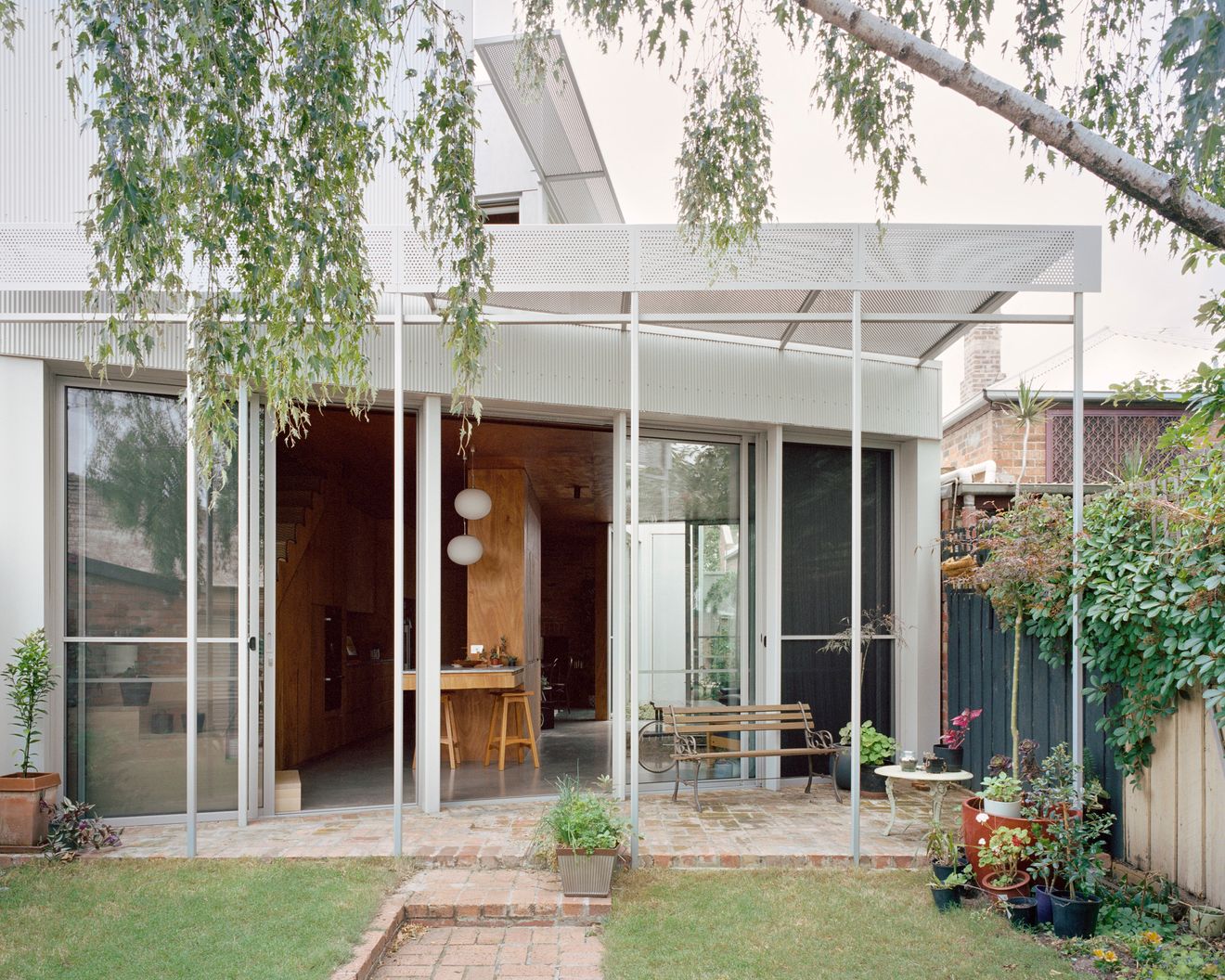 This terrace house renovation creates a lush outlook from every room