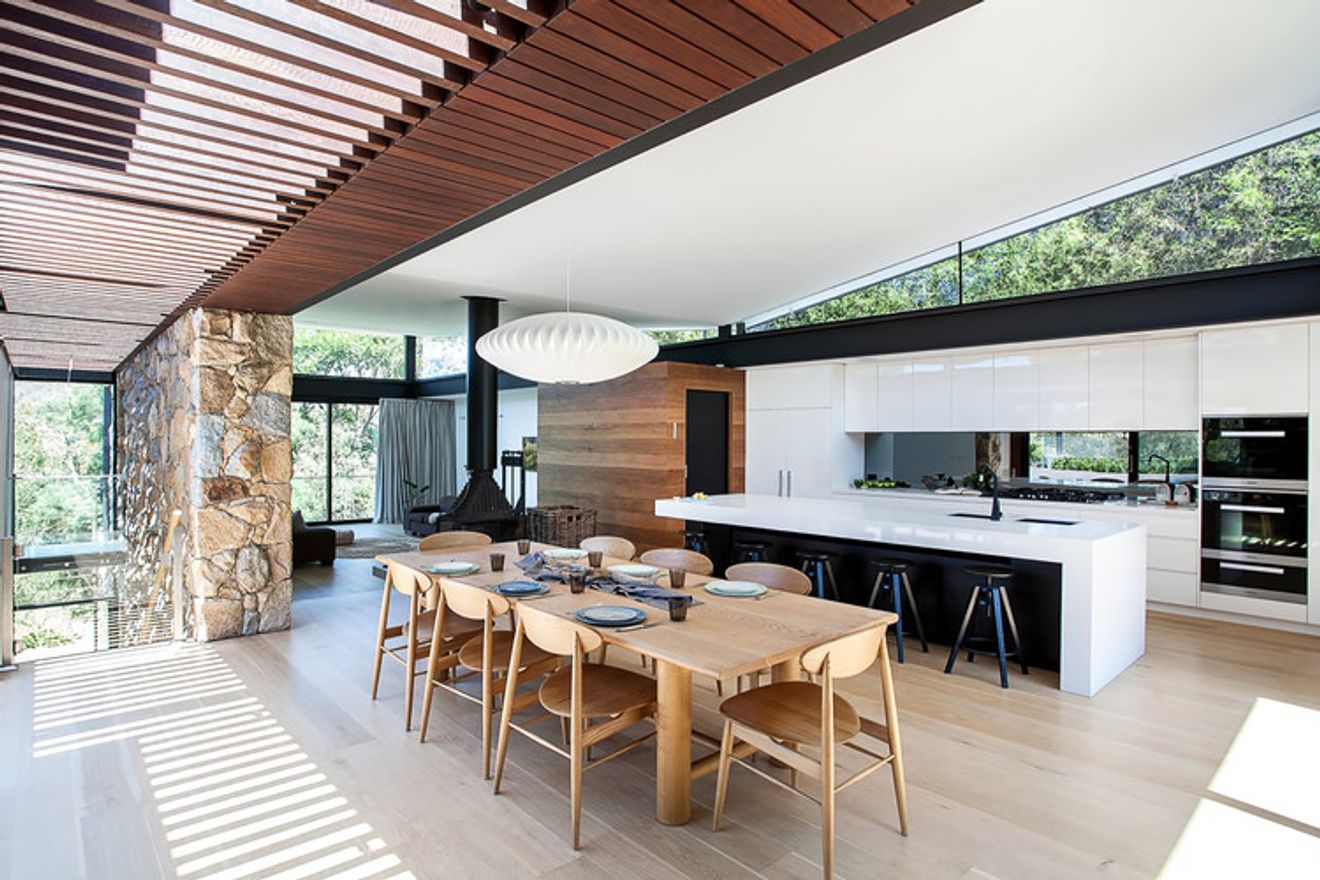 This House Cascades Down River Bank on Beautiful But Difficult Site