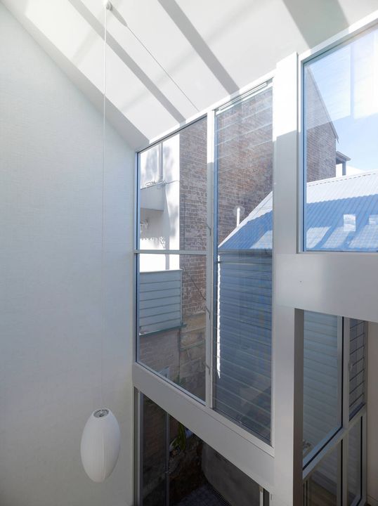 A Rear Facade Playfully Filters and Disperses Light at Balmain House