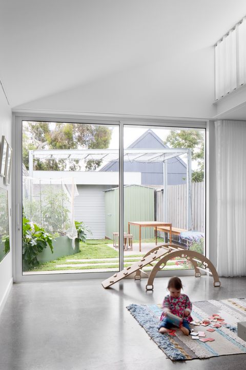 This addition feels spacious in spite of a long, narrow block...