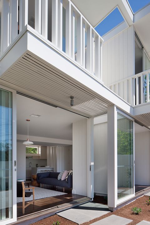 Folded Facades Give Two Identical Homes Their Own Identity