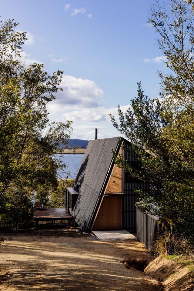 New Spaces Draped Around an Original Cedar-lined Shack Like a Tent