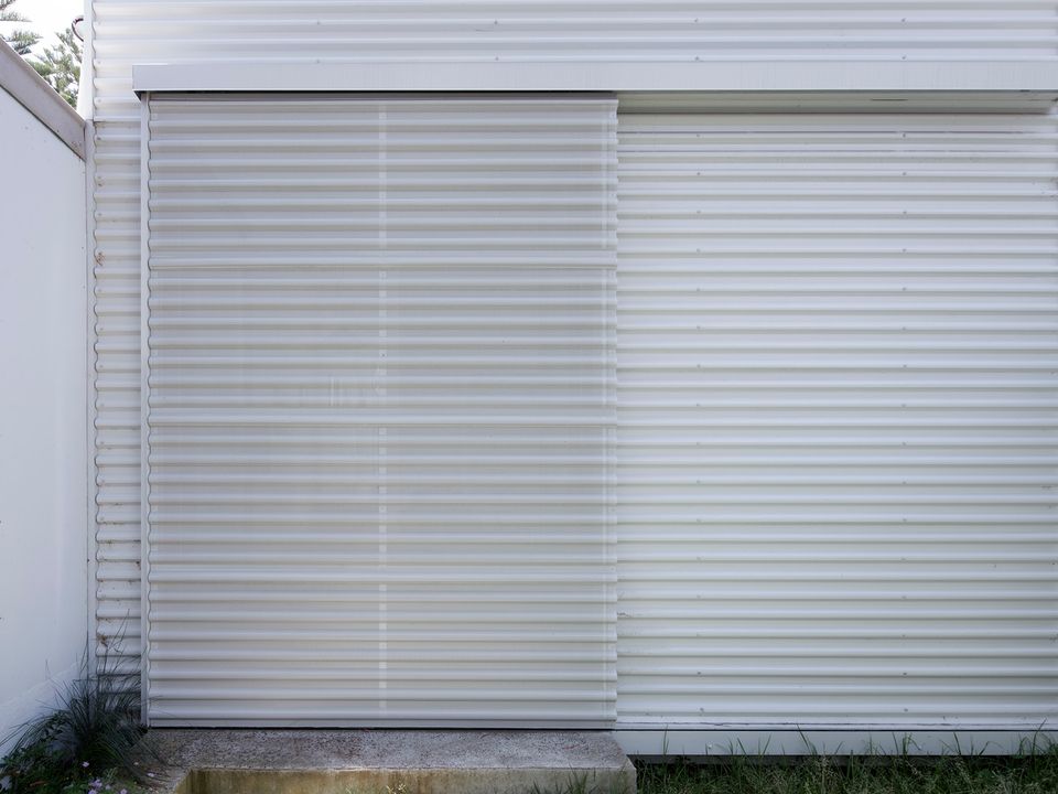Perforated Sliding Door Provides Privacy Without Blocking Views or Light