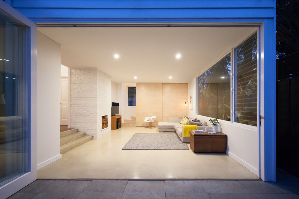 A White Box is 'Plugged' Into the Side of This Existing Home