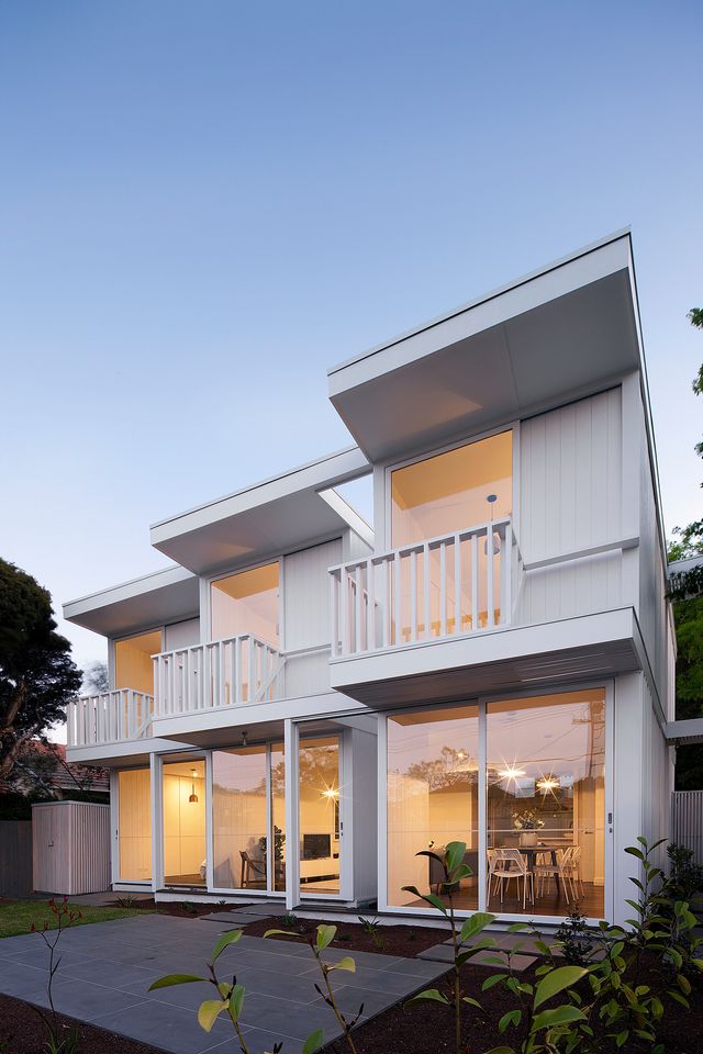 Folded Facades Give Two Identical Homes Their Own Identity